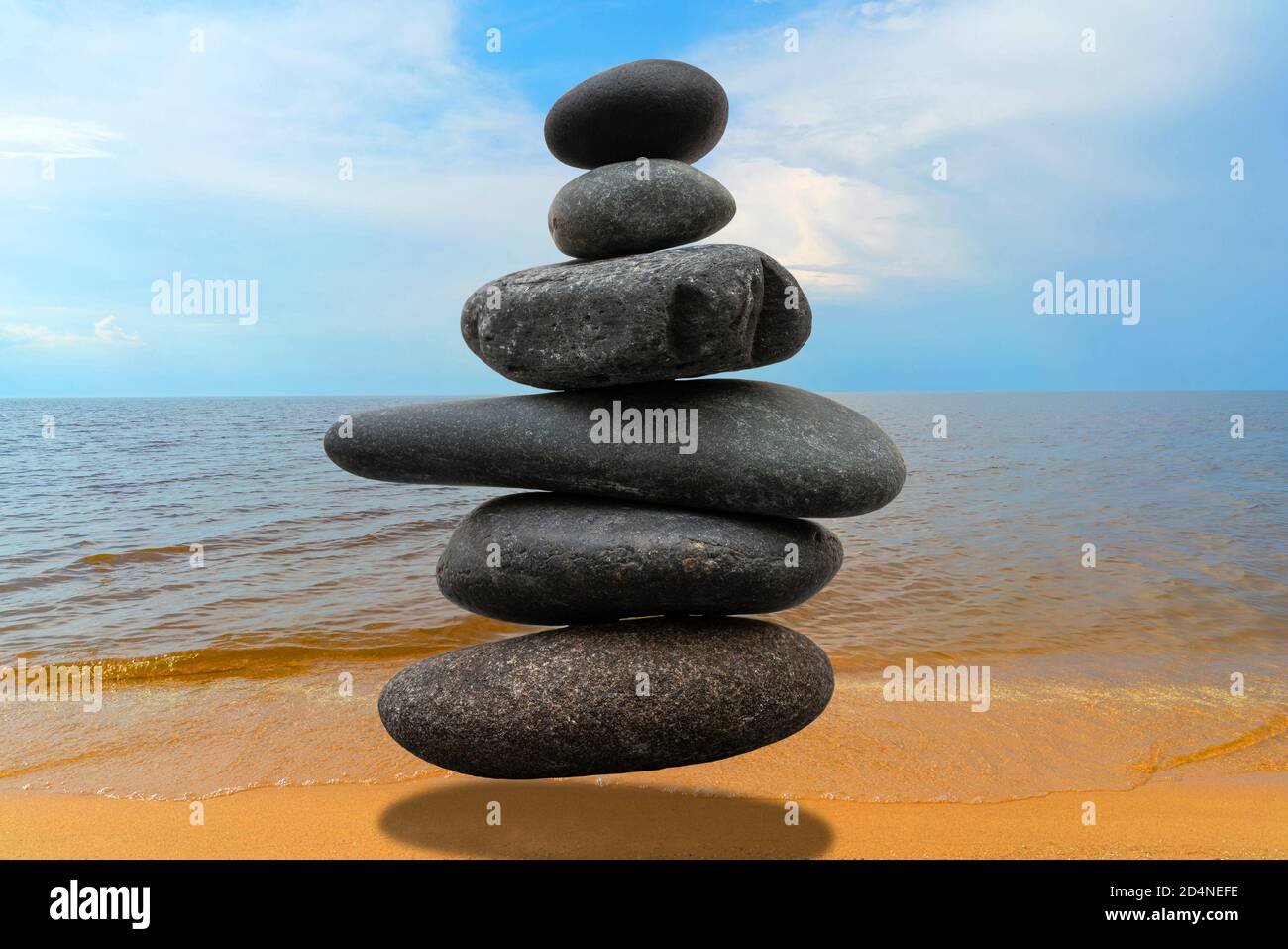 Stack of pebbles in an unstable state. A pyramid made of flat stones ...