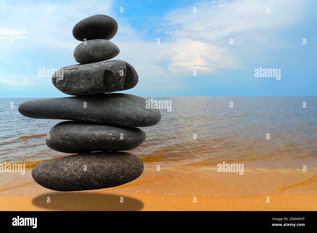 Hand stacking stones hi-res stock photography and images - Alamy