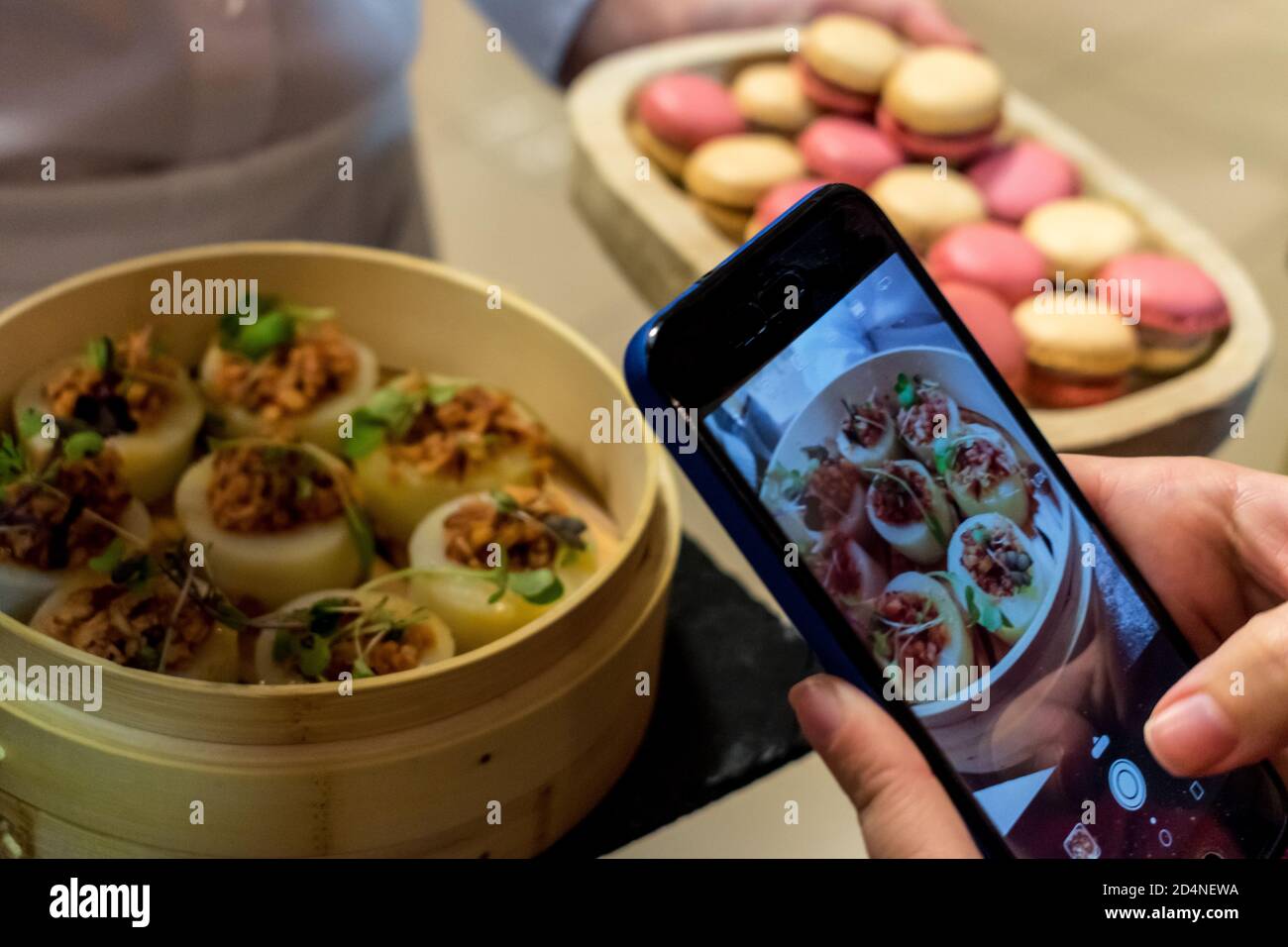Person taking photos of the food before eating Stock Photo - Alamy