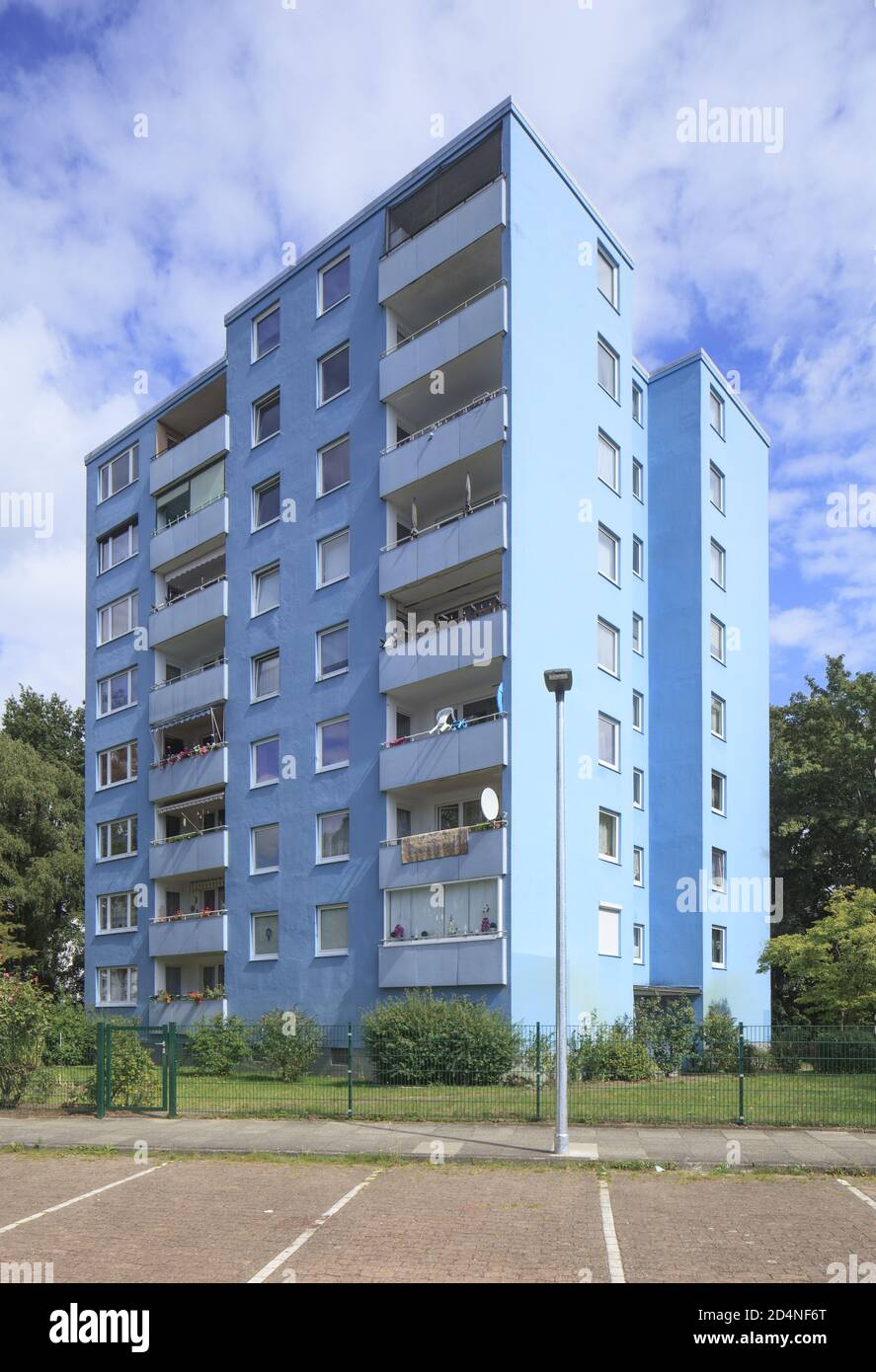 Vertical structured light blue residential building in a town Stock ...