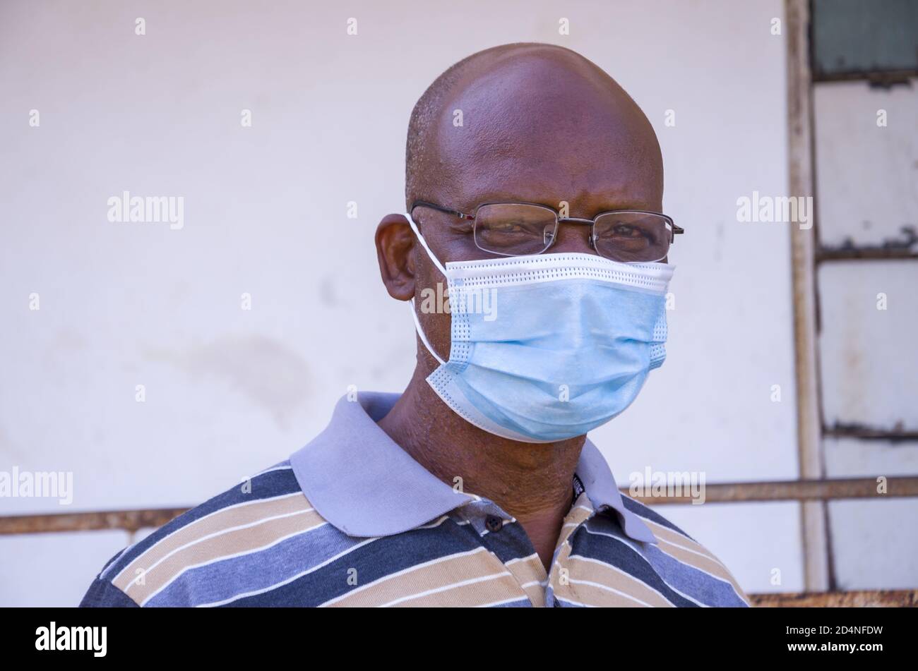 Portrait of a middle-aged African man wearing a face Stock Photo - Alamy