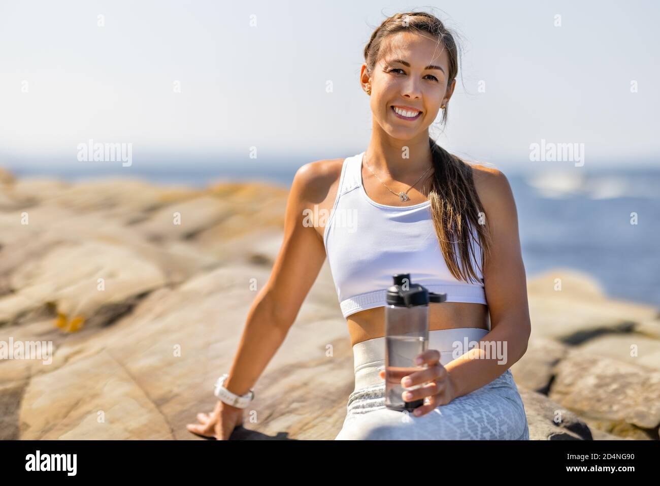 Fit Woman Taking Break During Outdoor Workout Stock Photo - Alamy