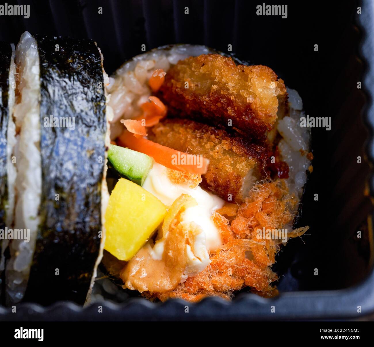 A close-up of a Korean-style seaweed rice roll, chicken roll, beef roll ...