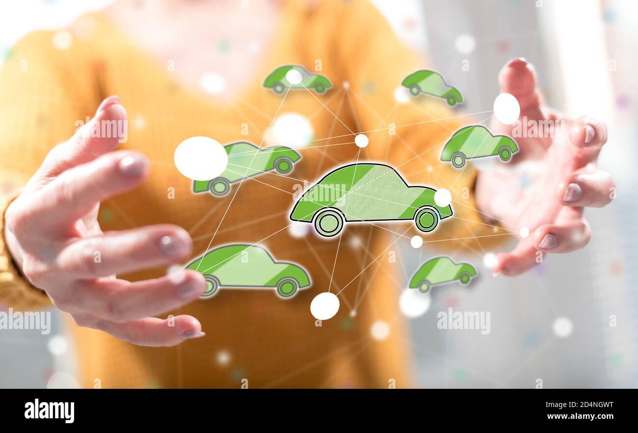 Connected car concept between hands of a woman in background Stock ...