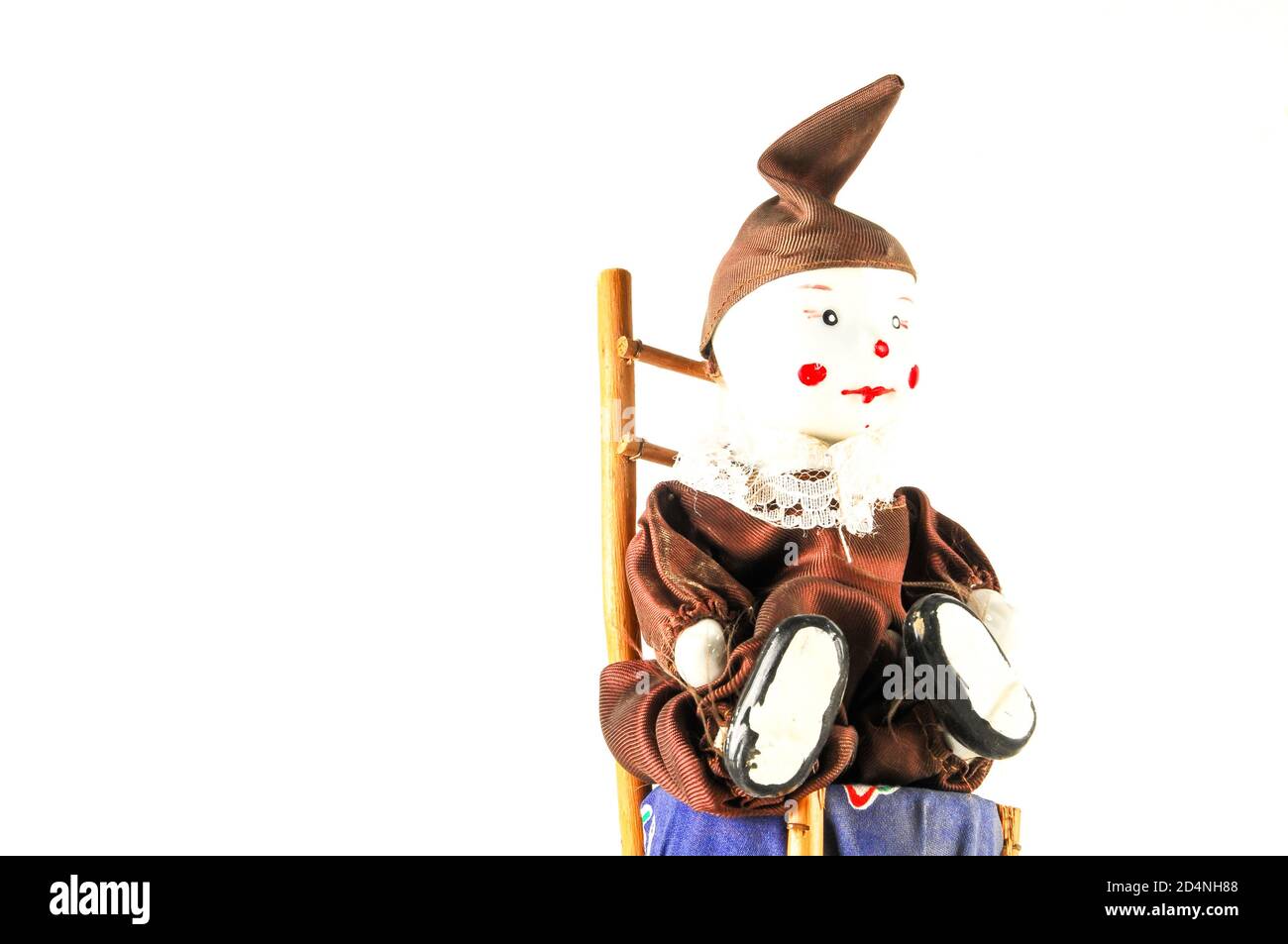 Pierrot toy doll on white background Stock Photo - Alamy