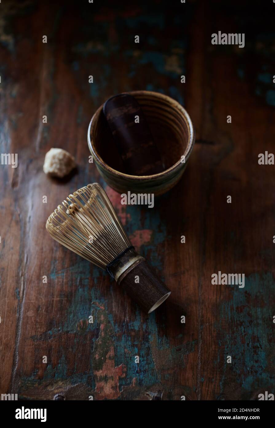 Bamboo tea whisk on rustic wooden background. Close up Stock Photo - Alamy