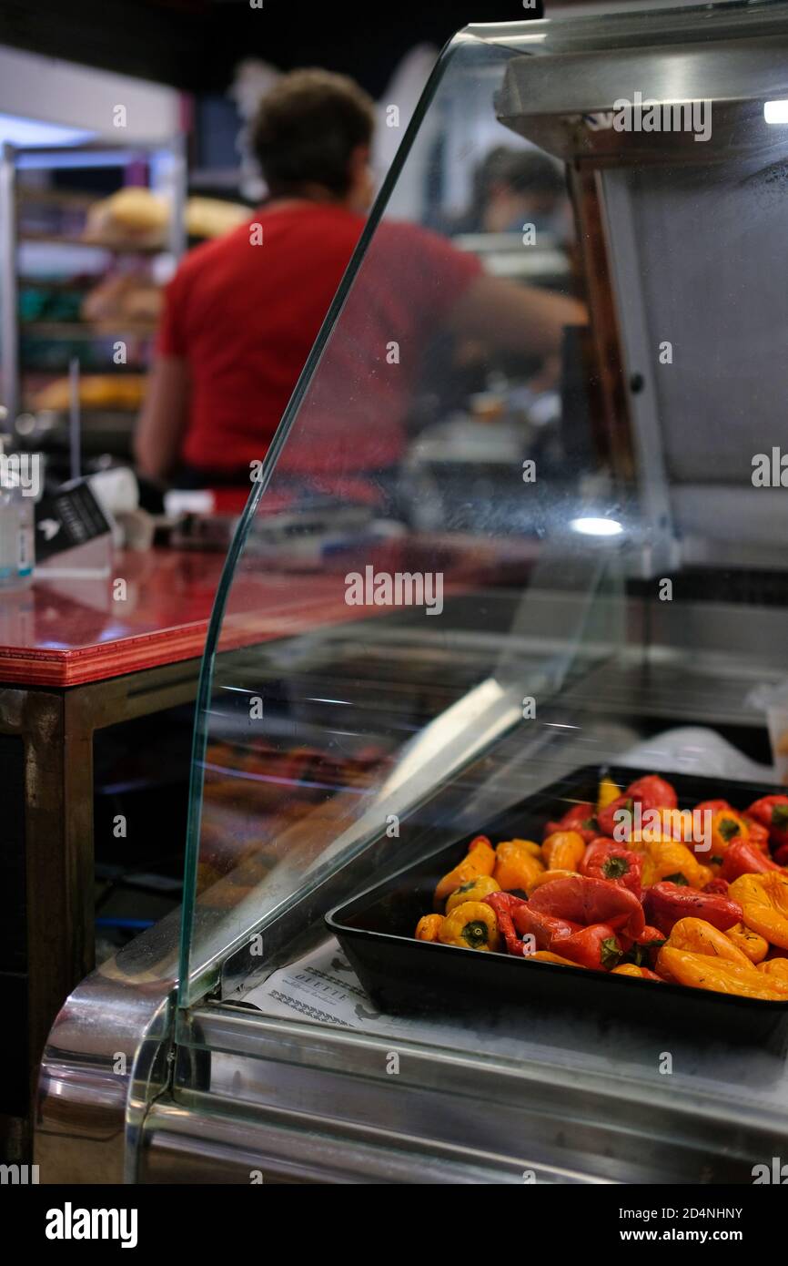 Vertical shot of a pan with grilled peppers at a cafeteria Stock Photo ...