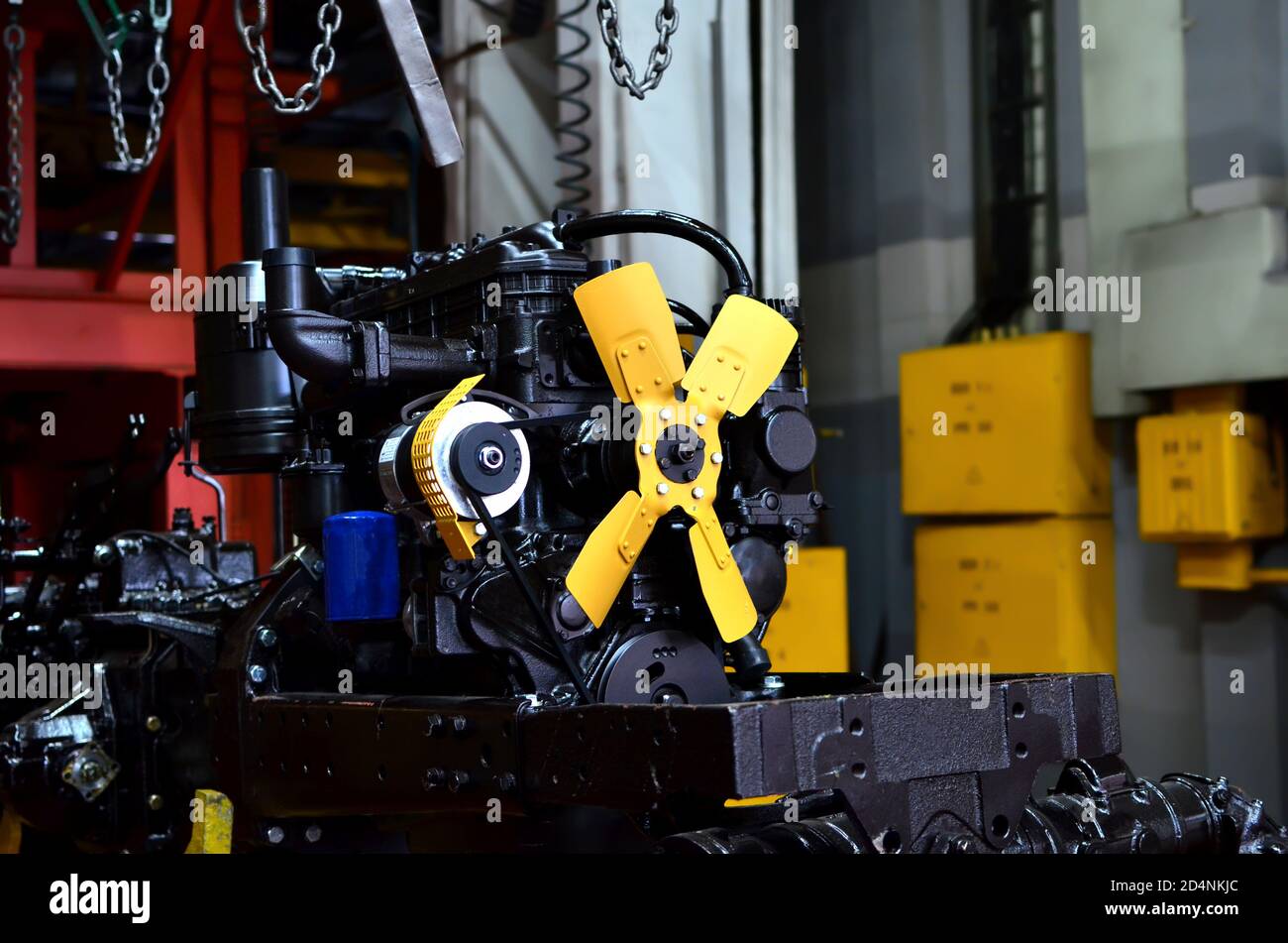New engines on assembly line of industrial factory. Tractor Manufacture ...