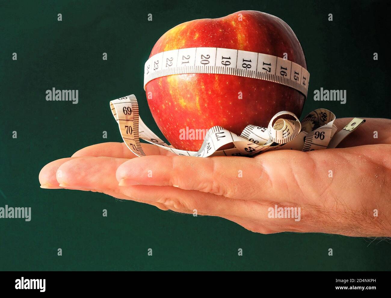 Diet Apple and Meter on the Hand Stock Photo - Alamy