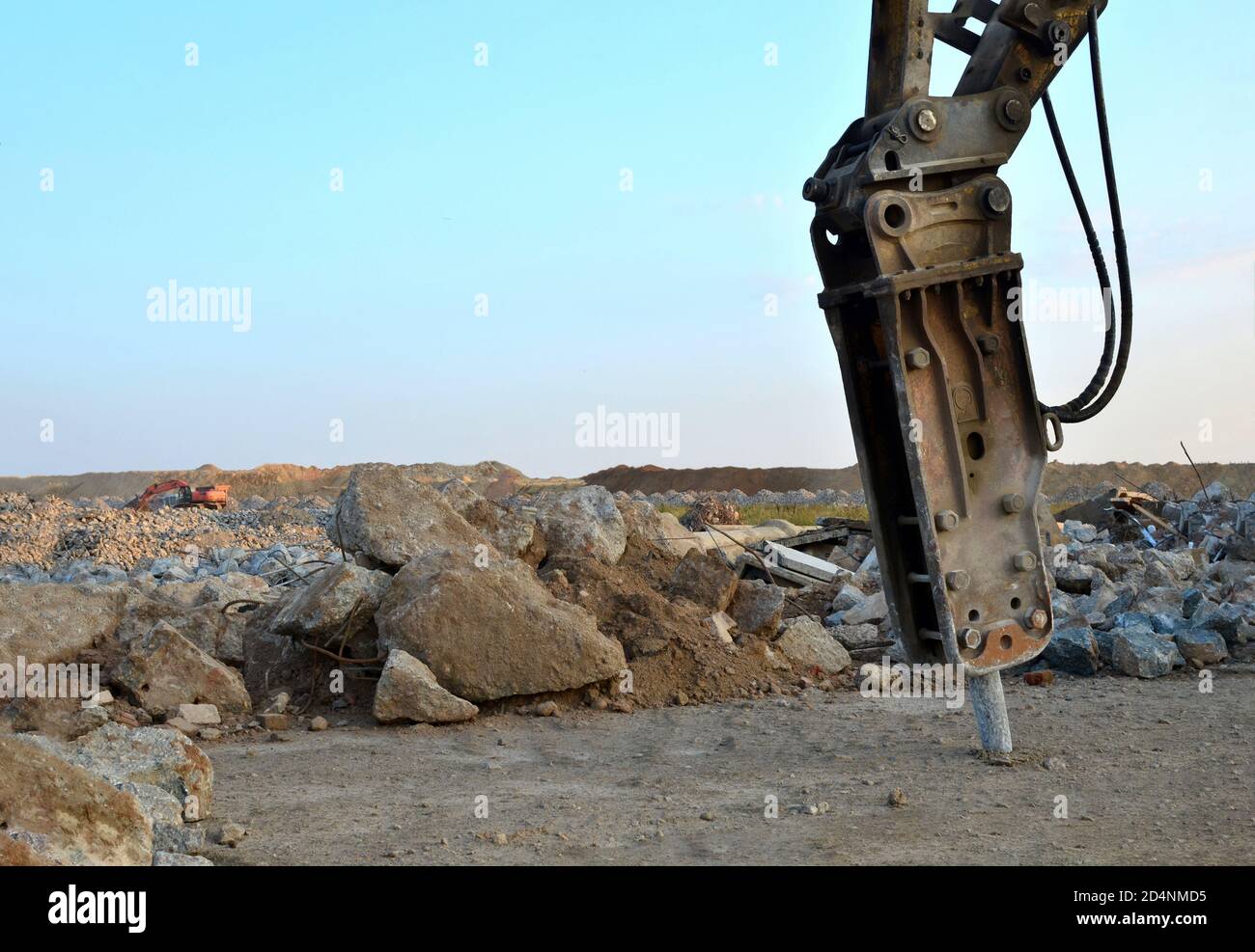 Excavator with hydraulic breaker hammer for the destruction of concrete ...