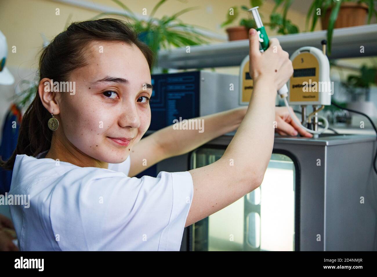 Motor oil modern production plant. Chemical lab. Young Asian woman ...