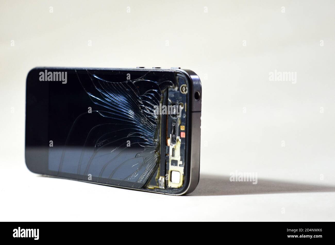 Broken glass screen of a mobile phone on a white background. Repair ...