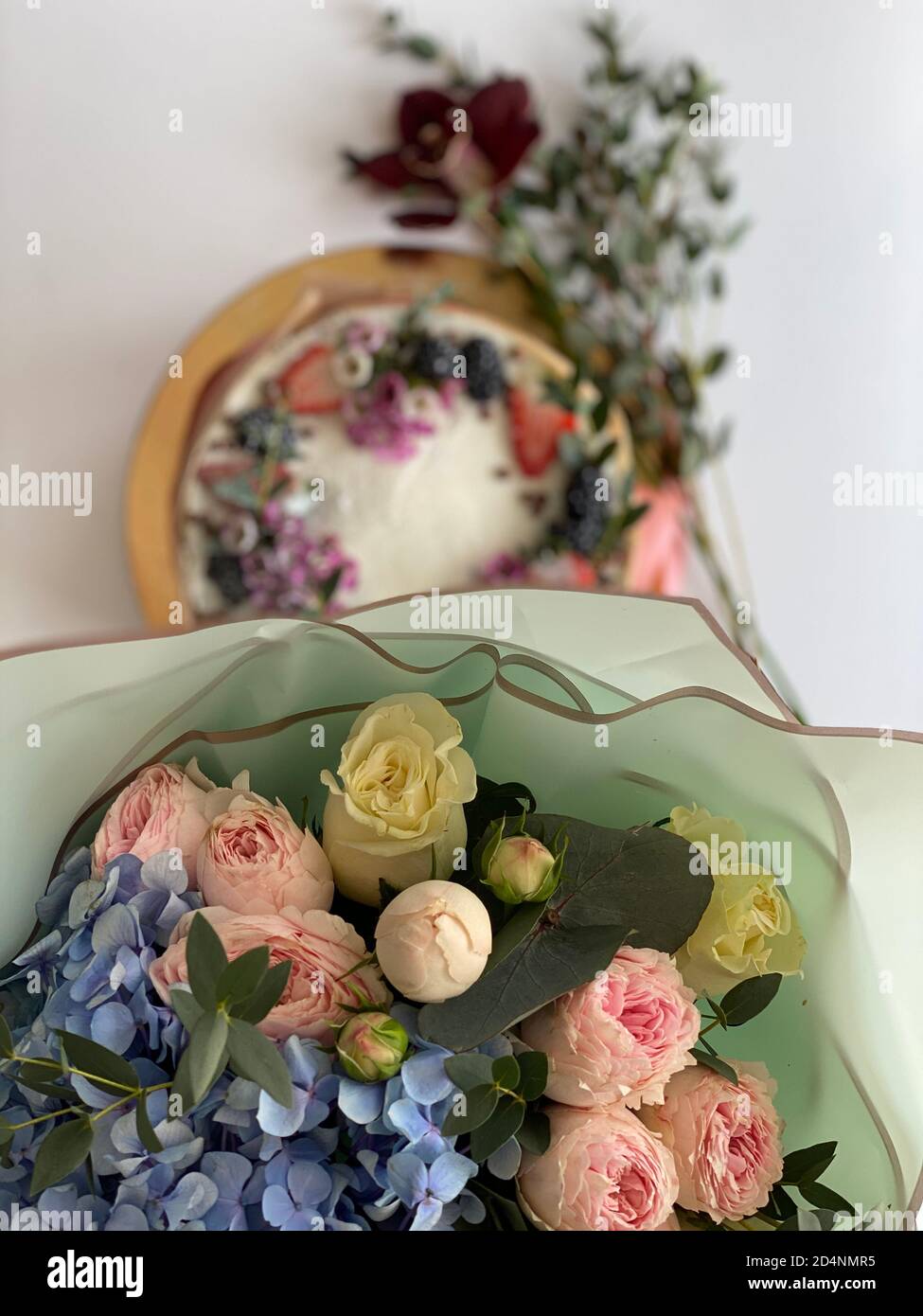 Still life with flowers and cake, vertical Stock Photo - Alamy