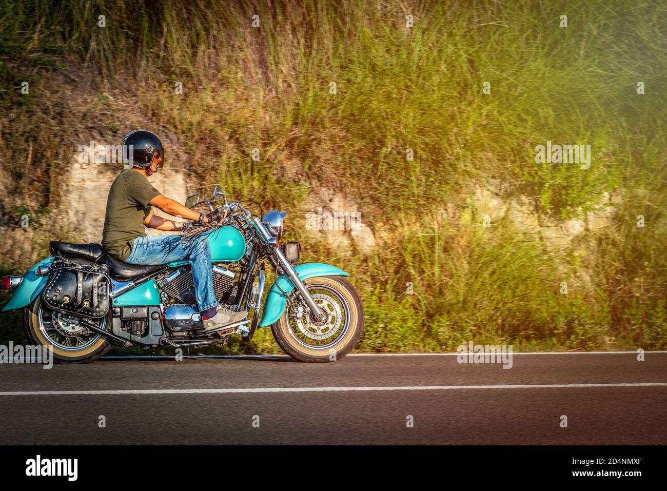 Motorcyle ride on a country road at sunset Stock Photo - Alamy