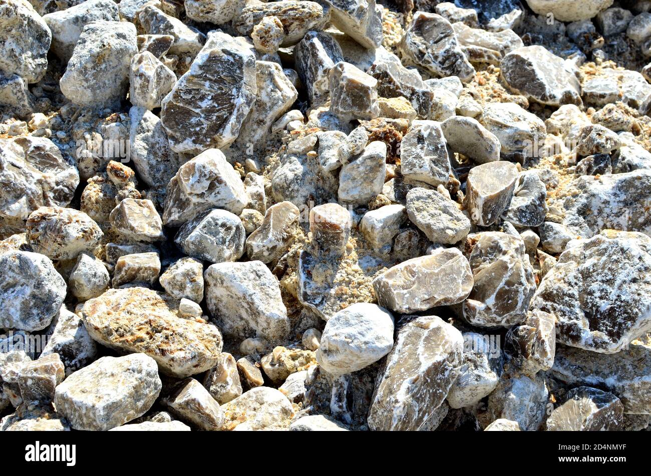 Natural gray gypsum stone. Close up image of stones with black and ...