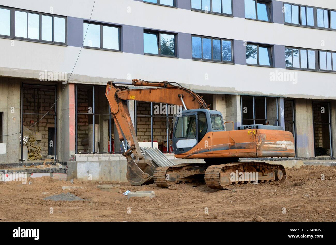 Hydraulic excavator installing pipeline hi-res stock photography and ...