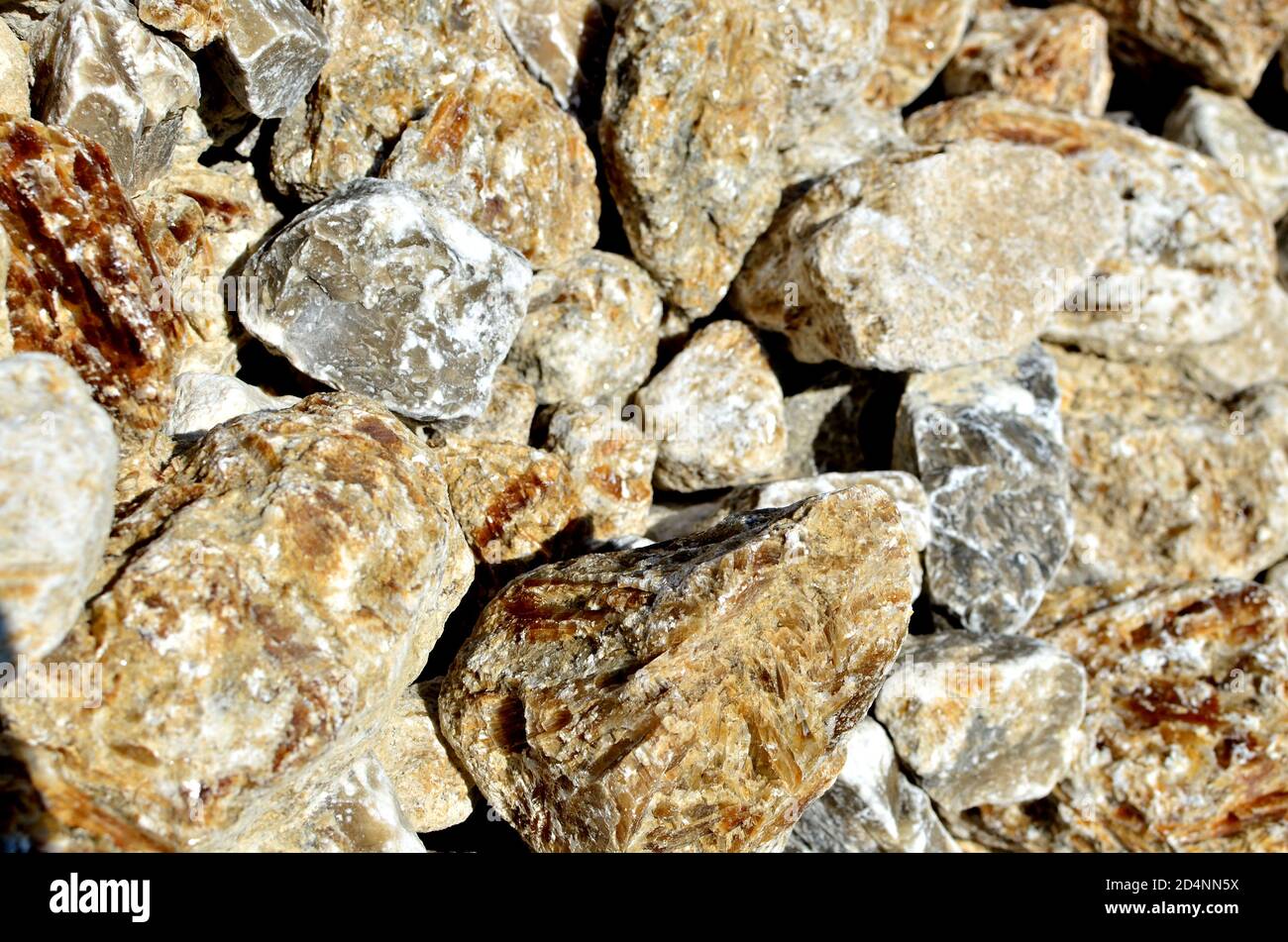 Natural gray gypsum stone. Close up image of stones with black and ...