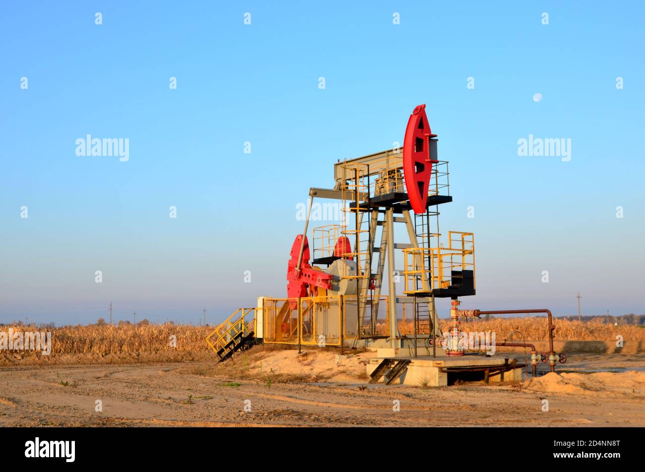 Oil drilling derricks at desert oilfield for fossil fuels output and ...