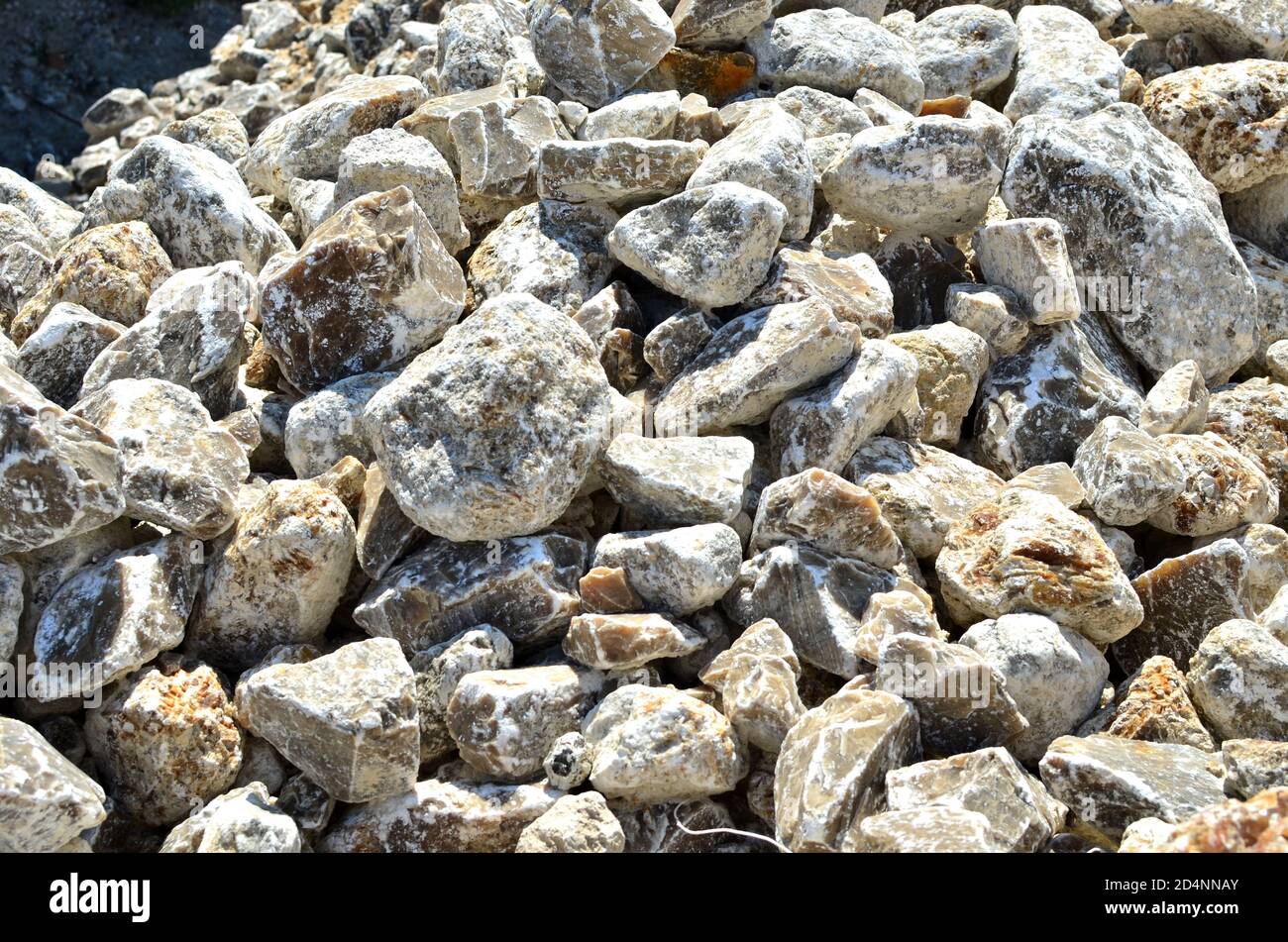 Natural gray gypsum stone. Close up image of stones with black and ...