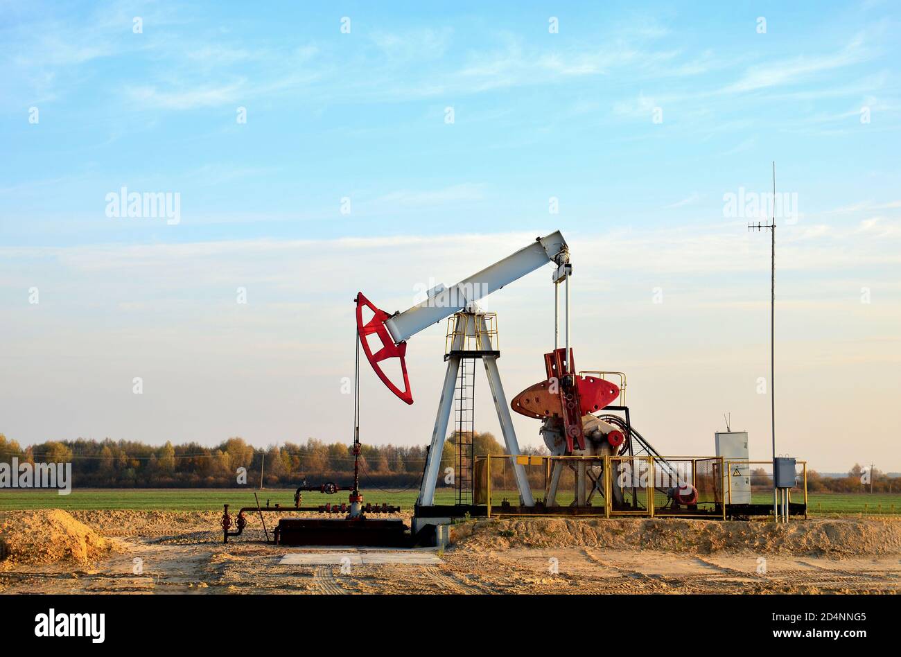 Oil drilling derricks at desert oilfield for fossil fuels output and ...