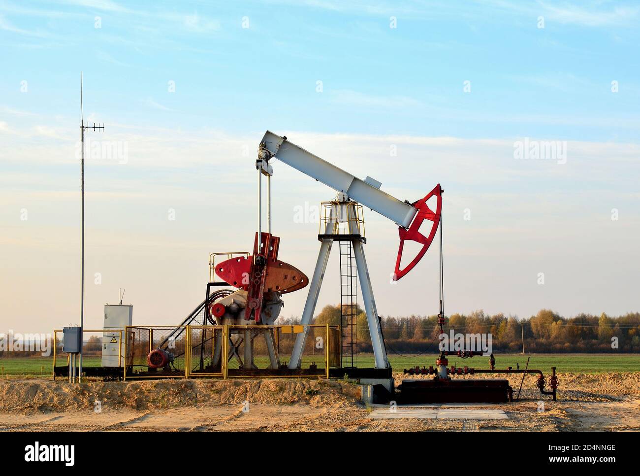 Oil drilling derricks at desert oilfield for fossil fuels output and ...