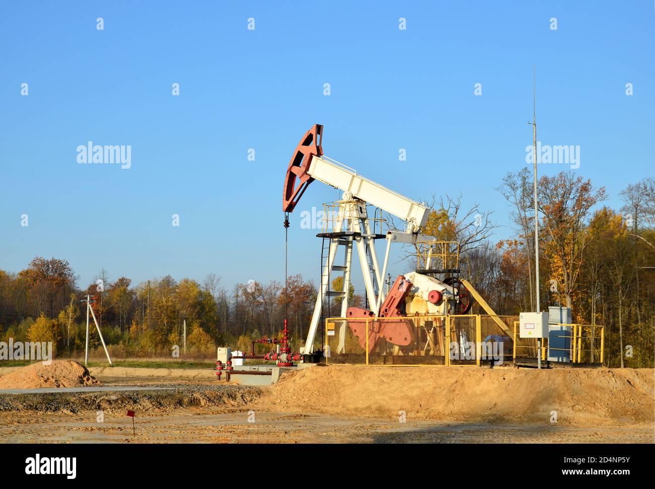 Oil drilling derricks at desert oilfield for fossil fuels output and ...