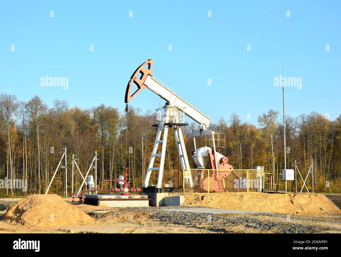 Oil drilling derricks at desert oilfield for fossil fuels output and ...