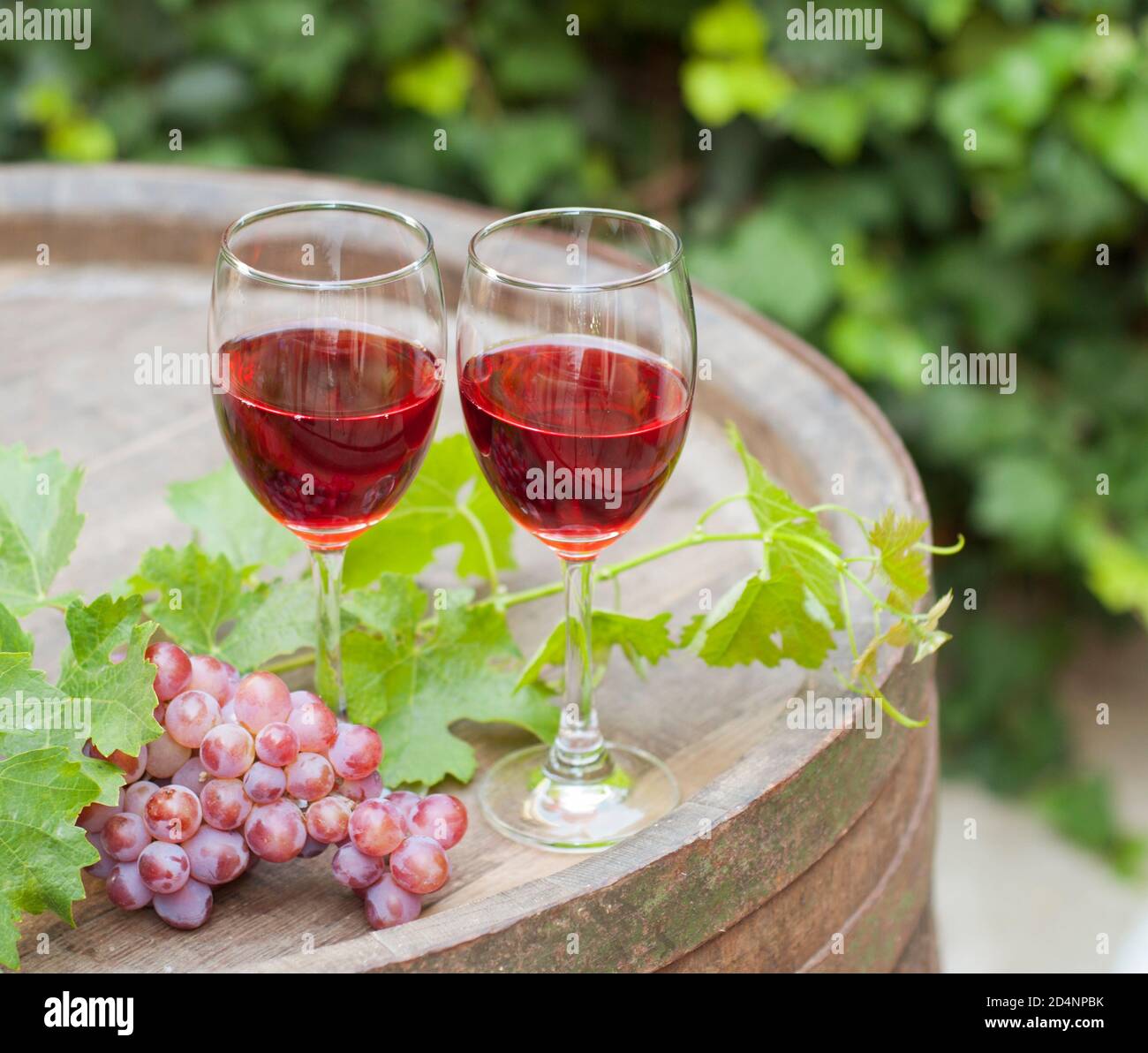 Glasses of wine on a wine barrel Stock Photo - Alamy