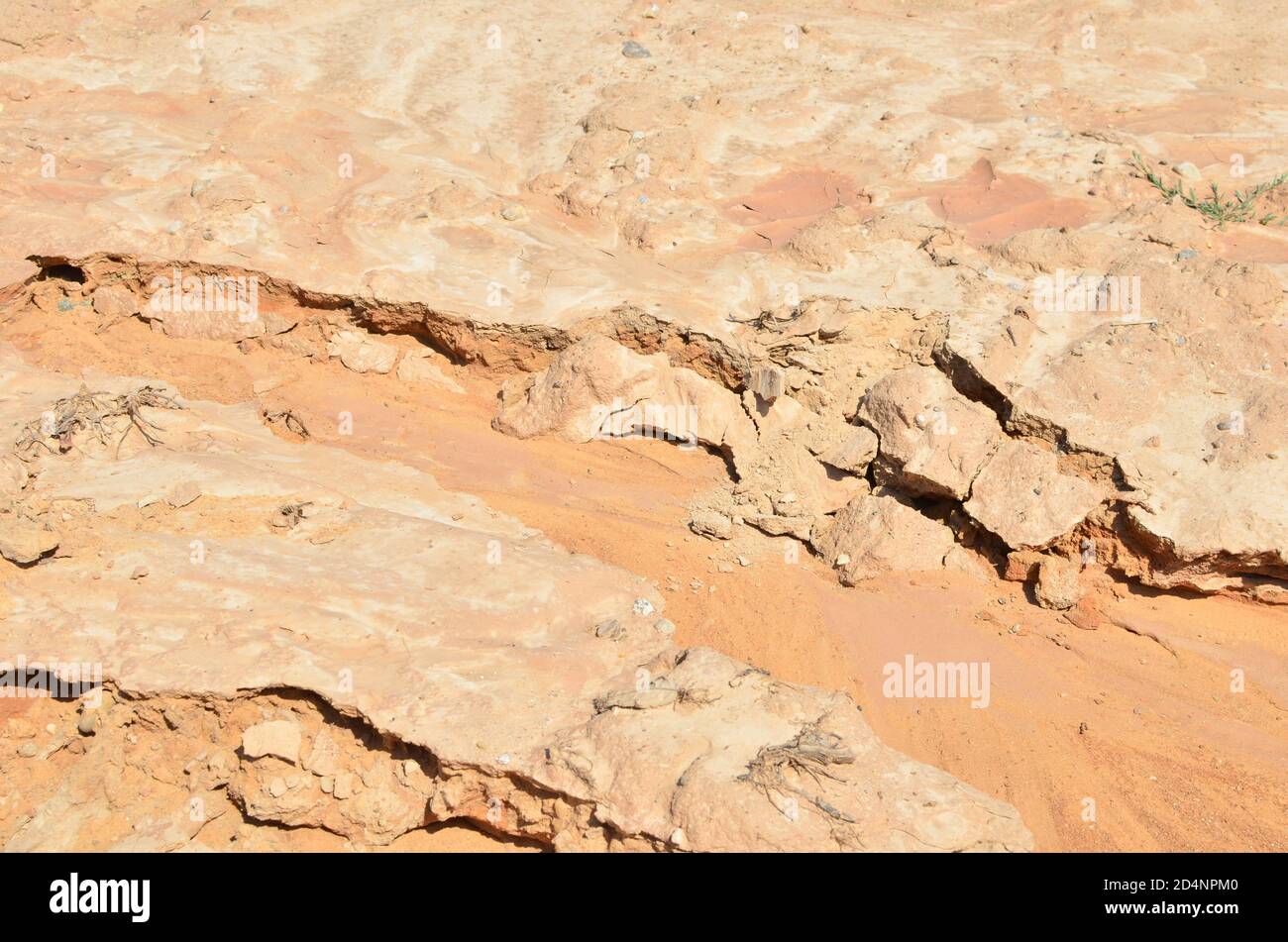 Shattered sand in the ground as a result of heavy torrential rains. Dry ...