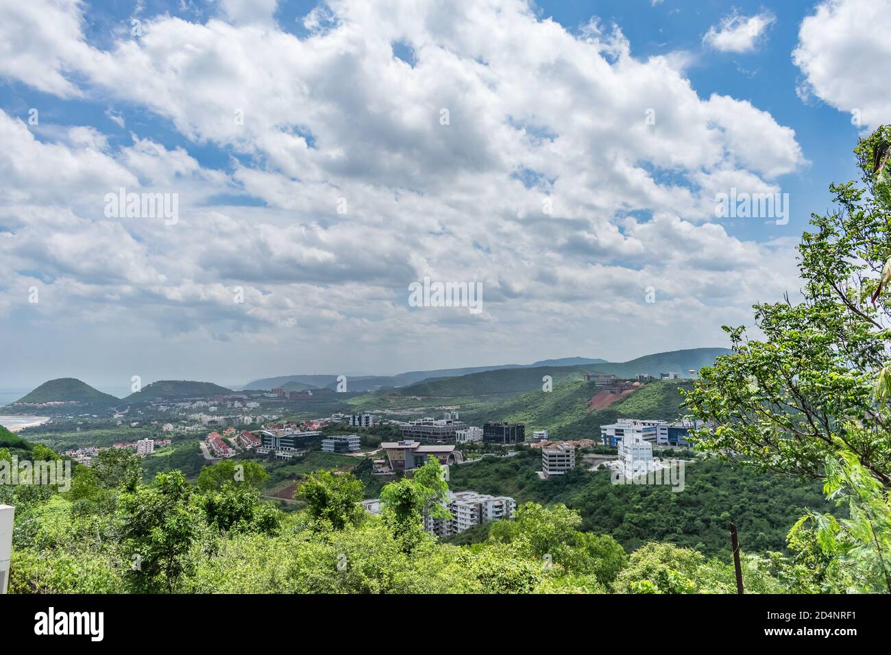 Awesome view of city building from top of a mountain with white sky ...