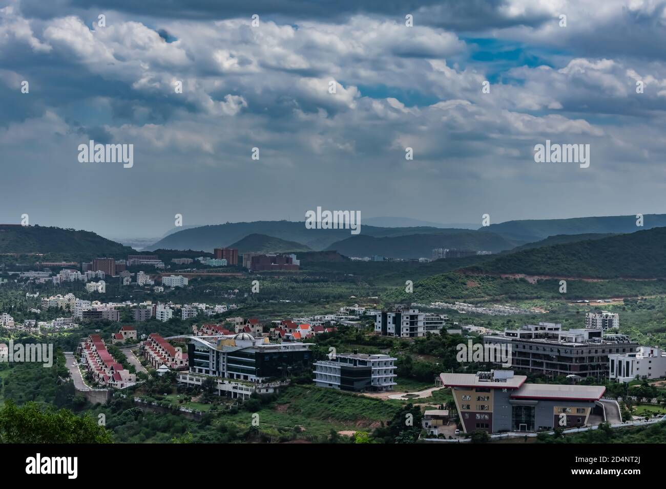Awesome view of city building from top of a mountain with white sky ...