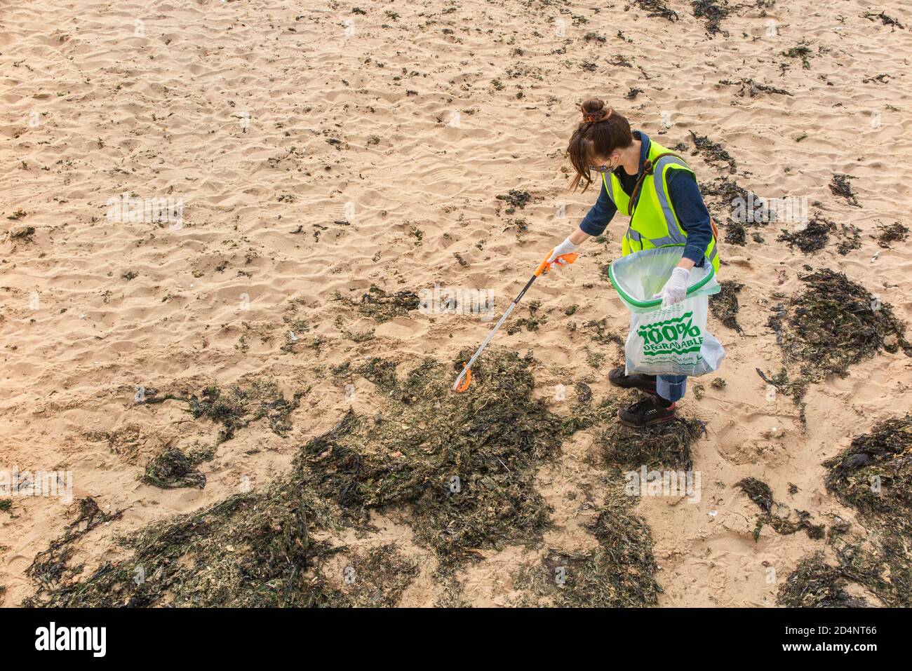 Volunteers help clean up litter from the main beach in Margate, kent ...