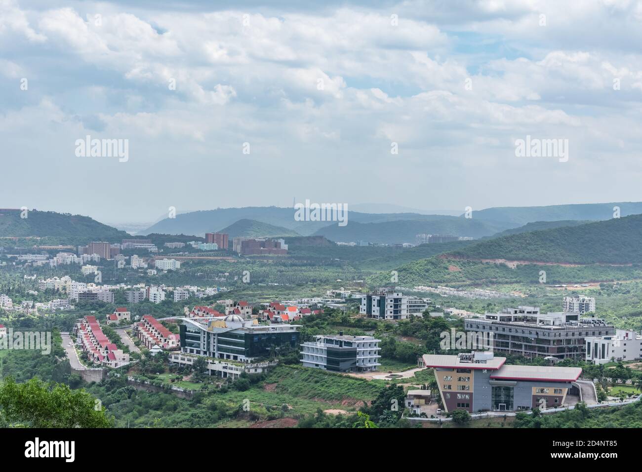 Awesome view of city building from top of a mountain with white sky ...