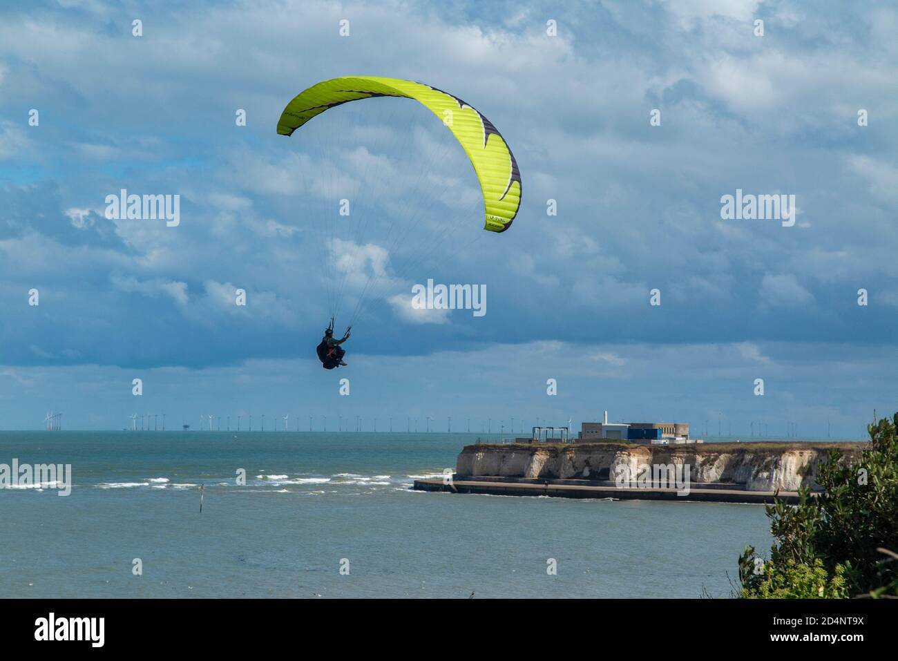 A paraglider flies above Beach Palm Bay in Margate, kent Stock Photo ...