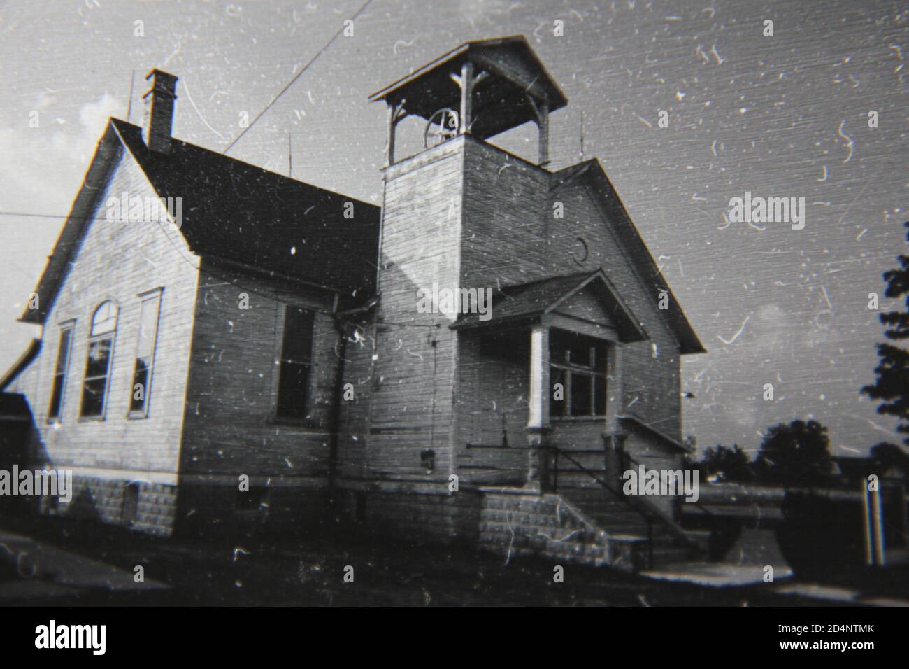 Fine 1970s vintage black and white photography of a shutterbug hobbyist taking camera out for a ...