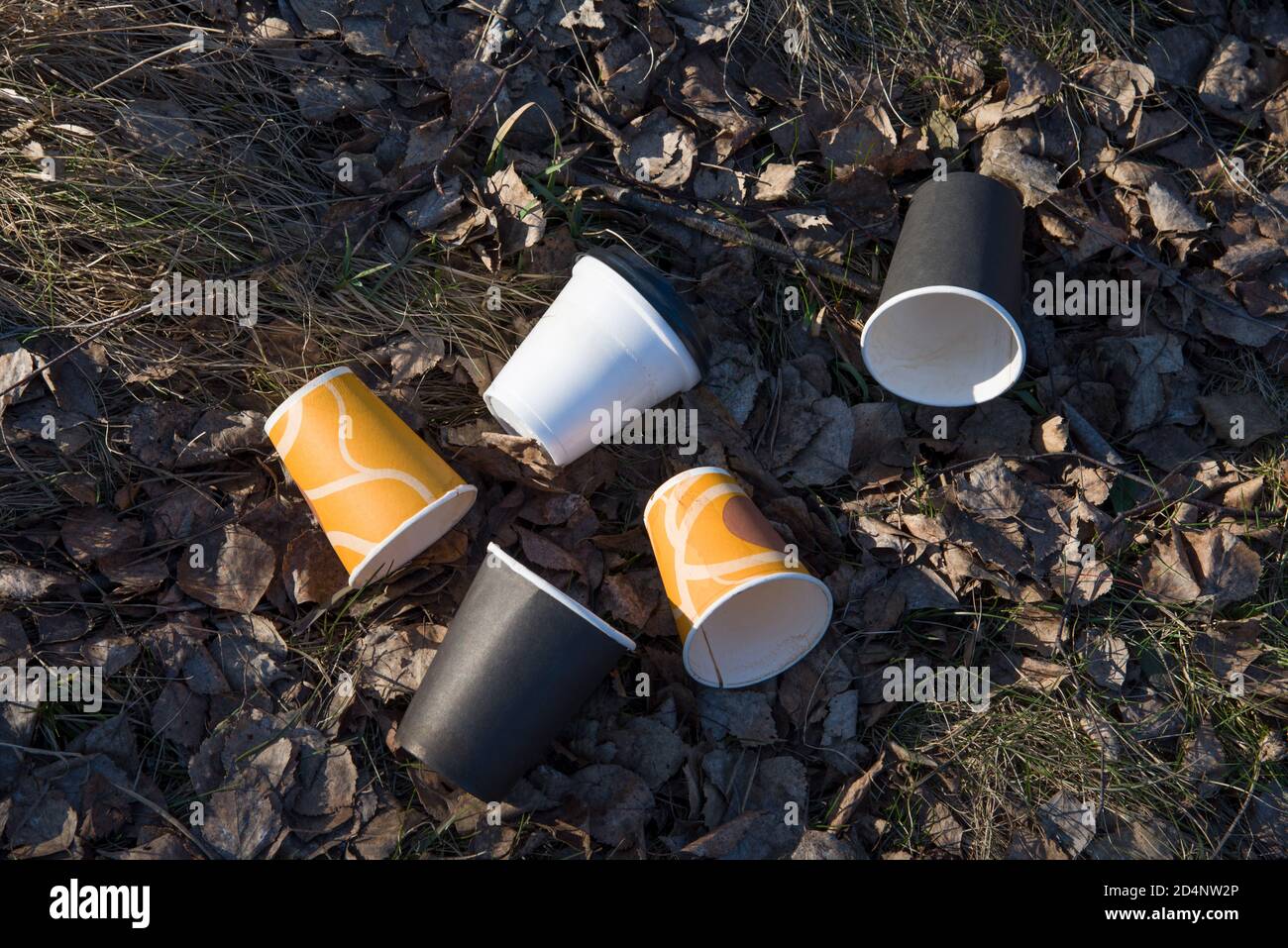 People throw paper coffee cups on ground. The problem of environmental ...