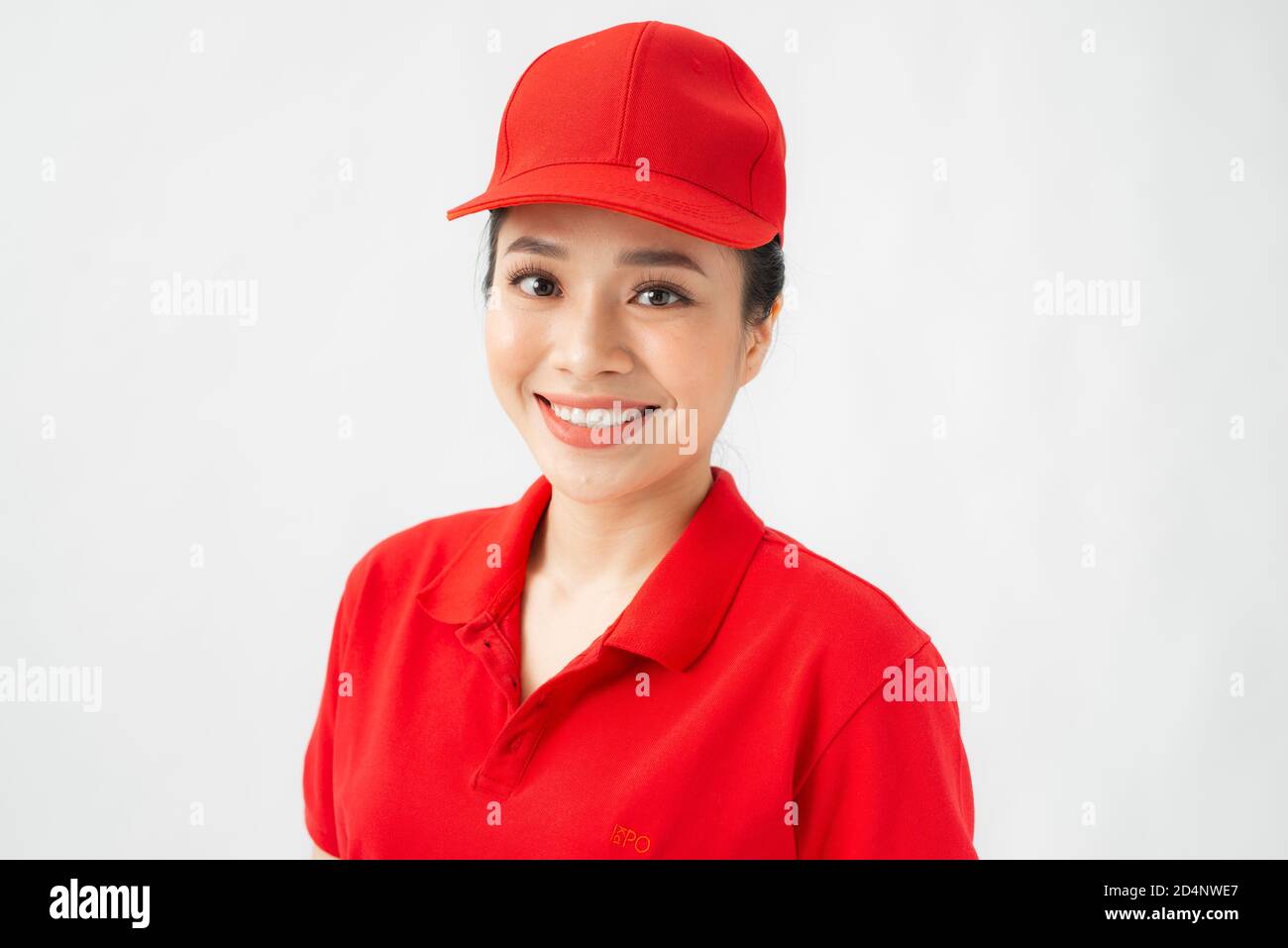 Delivery woman in red uniform isolated on white background Stock Photo ...