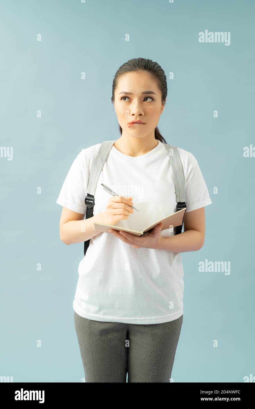 Puzzled indecisive troublesome college student frowns face in ...