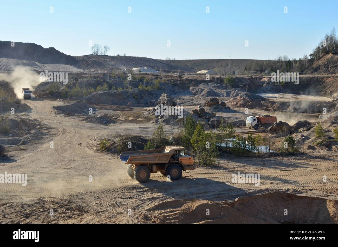 Big mining truck transportion sand in the open-pit. Heavy machinery in ...