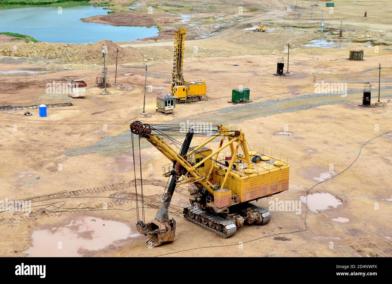Huge mining excavator in the limestone open-pit. Biggest digger working ...