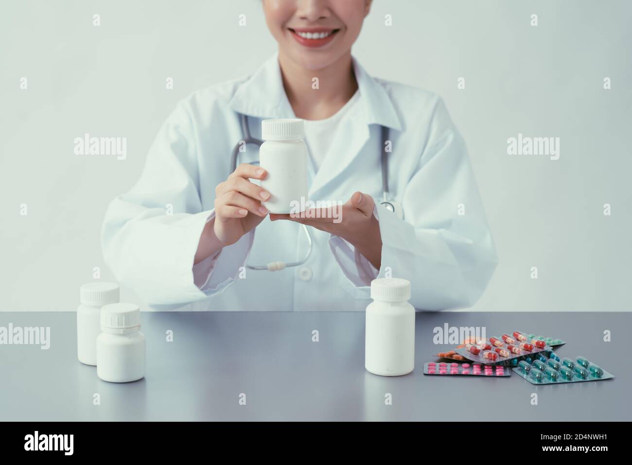 Doctor hand showing drug boxes at Office Desktop. Health care, Medical ...
