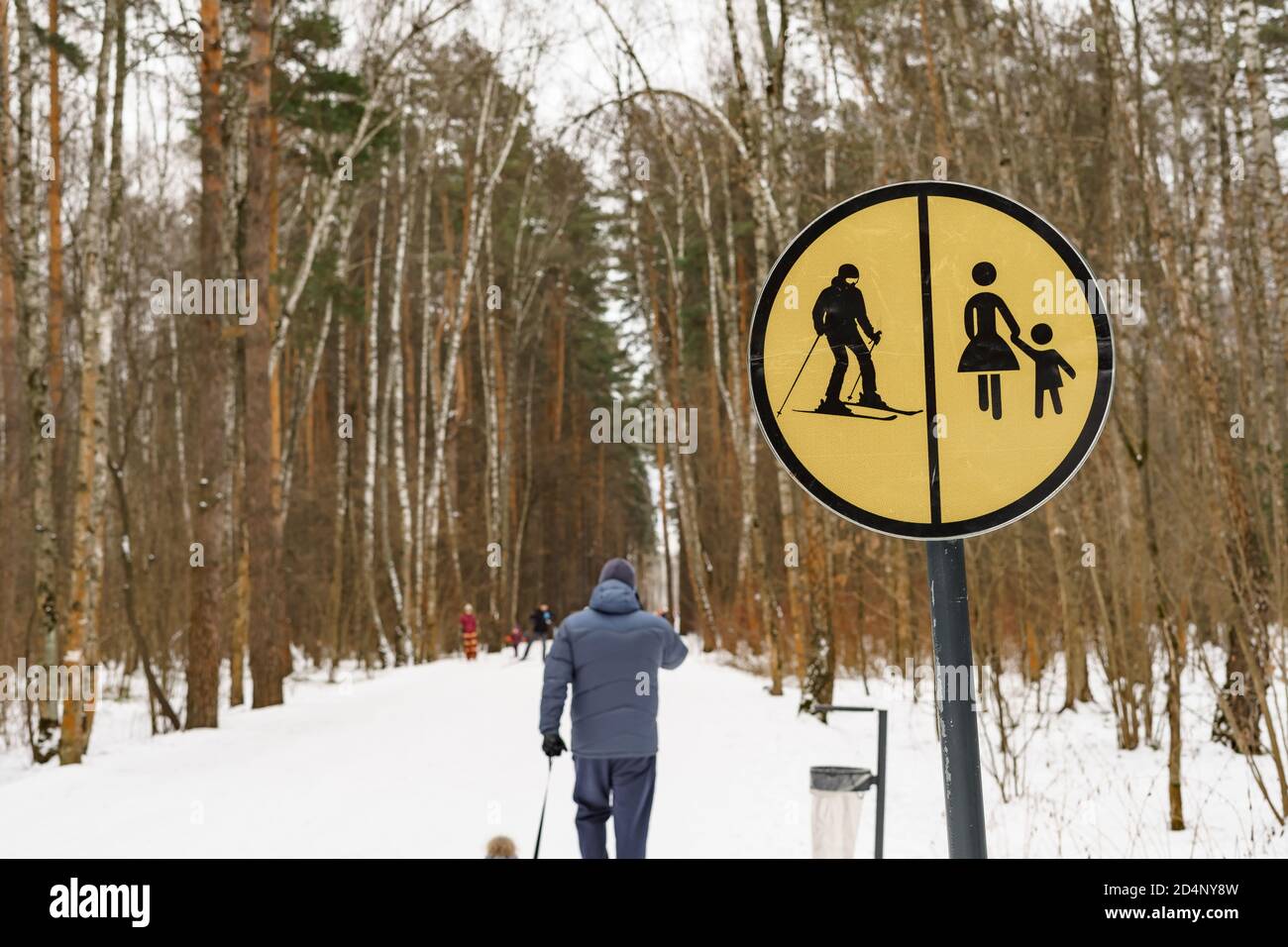 the snow trail is divided into 2 parts, one for skiers and the other ...