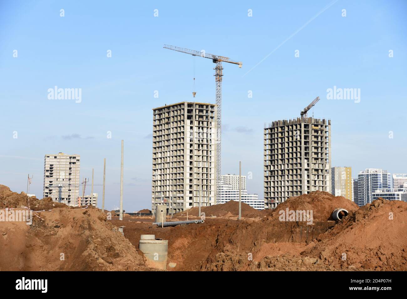Drainage pipes at the large scale construction site against tower ...