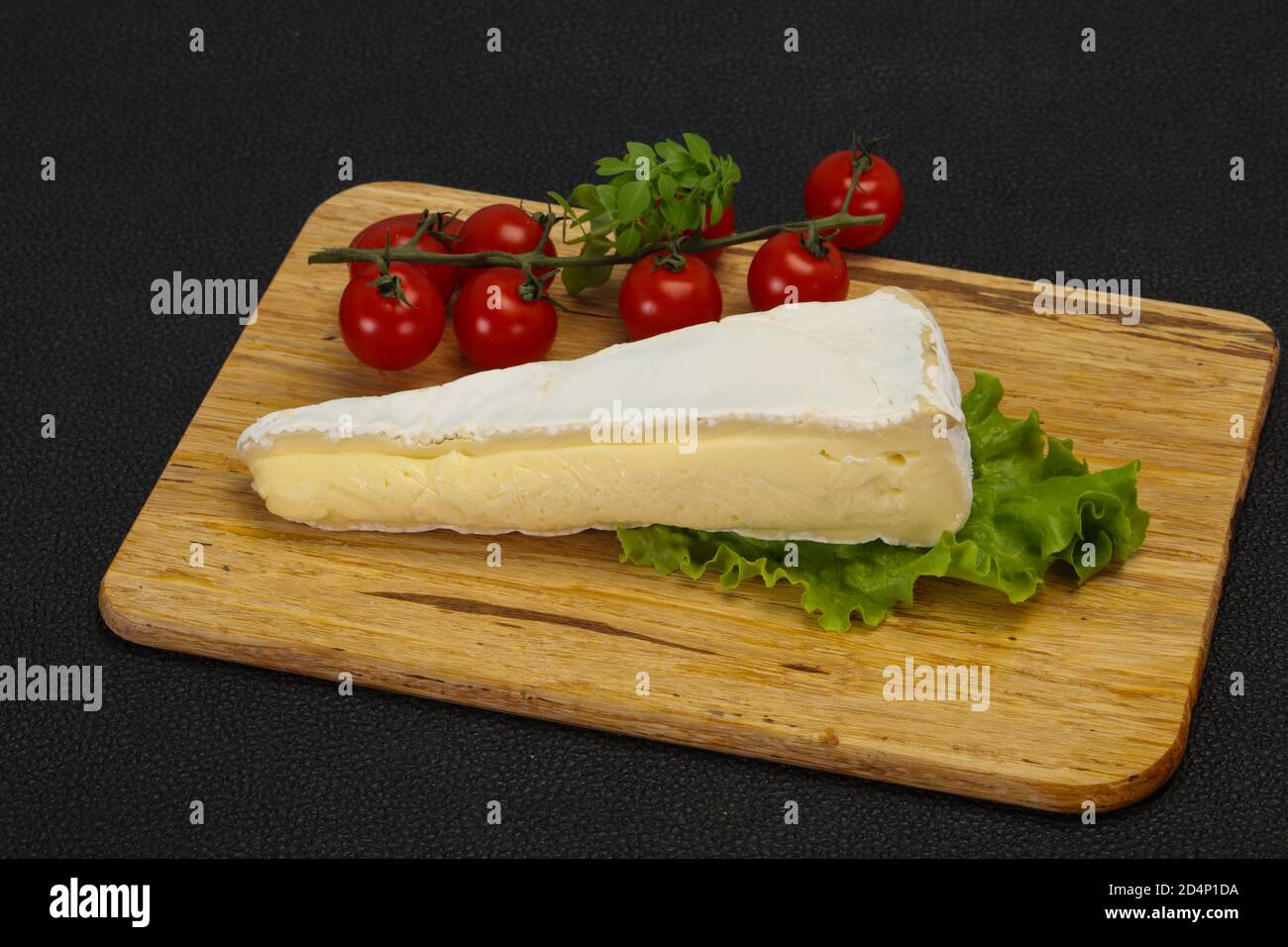 Brie cheese triangle served salad leaves Stock Photo - Alamy