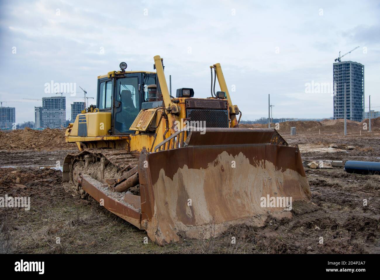 Bulldozer during land clearing and foundation digging at large ...