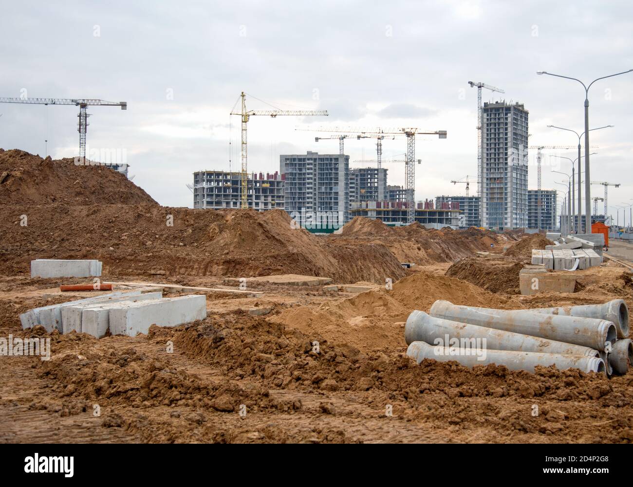 Drainage pipes at the large scale construction site against tower ...