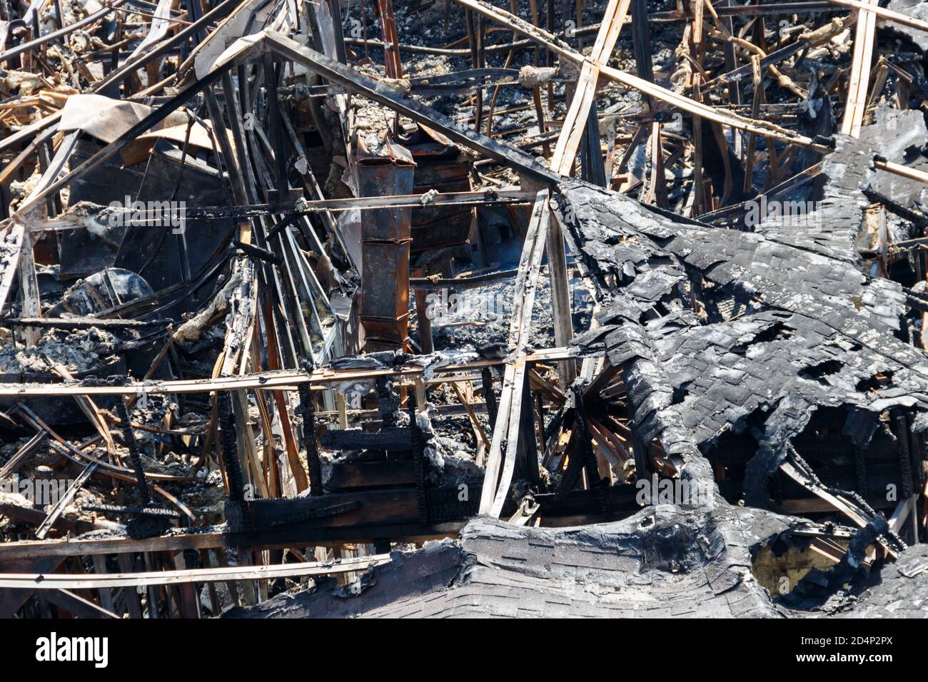 Ruins of building after the fire. Close-up at the site of the disaster ...