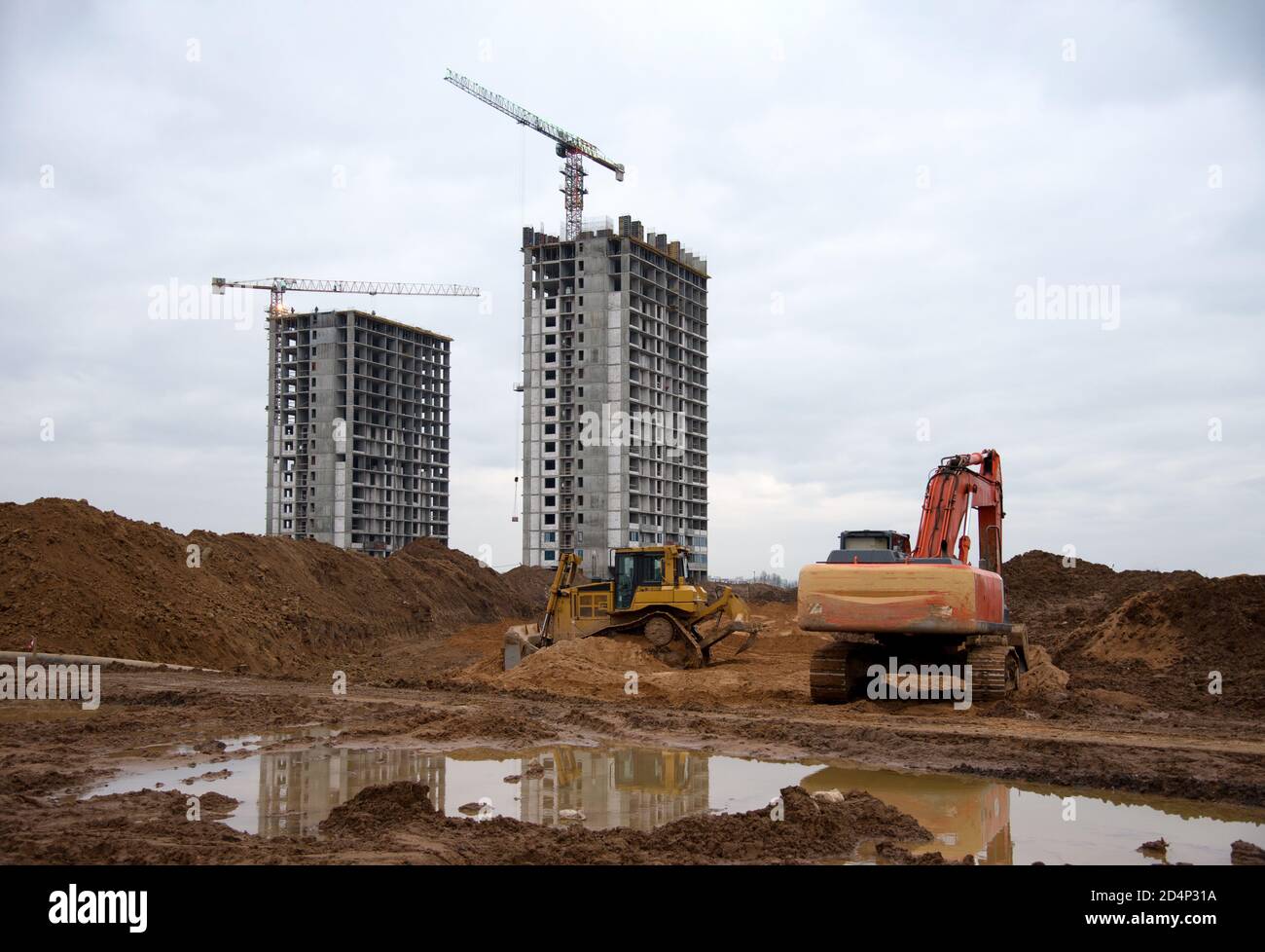 Excavtor and bulldozer digg ground at construction site for the ...