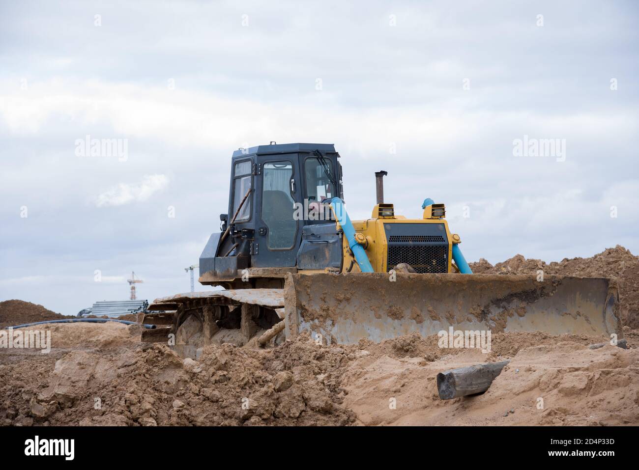 Dozer during land clearing and foundation digging at large construction ...