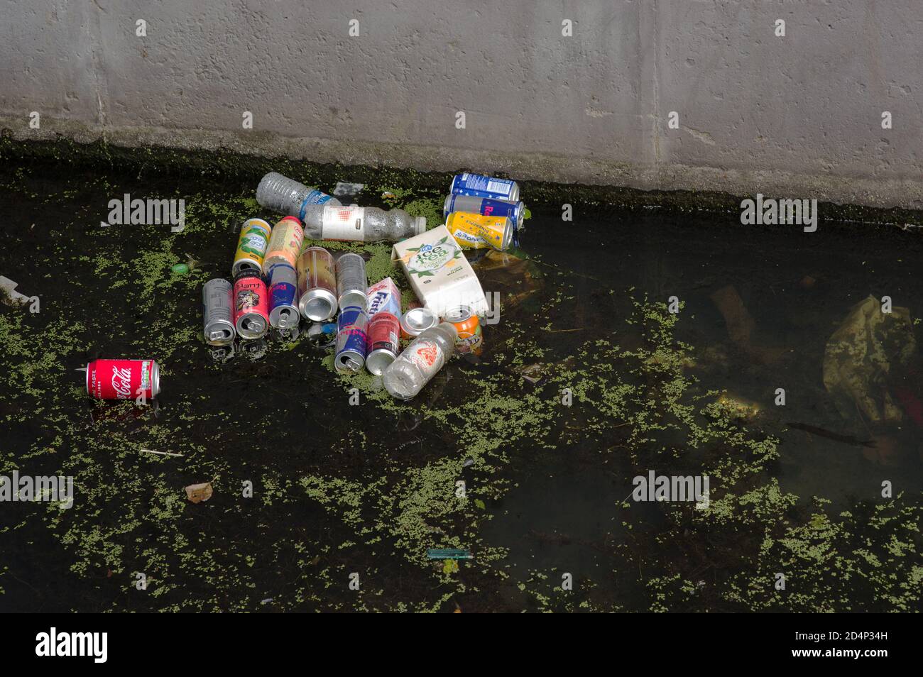 Arnhem, Netherlands - October 2, 2020: Water pollution with many soda ...
